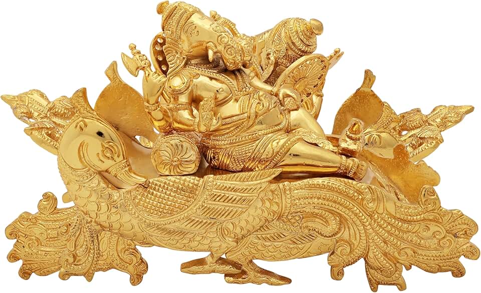 Exotic India 9" Gold Plated Ganesha Idol Relaxing on a Peacock Recliner ...